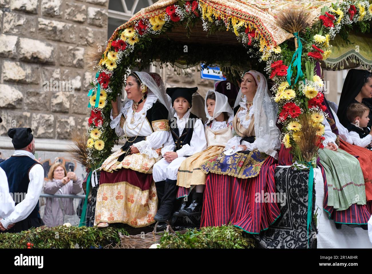 A traditional flower-covered, oxen-pulled chariot chart known as a ...