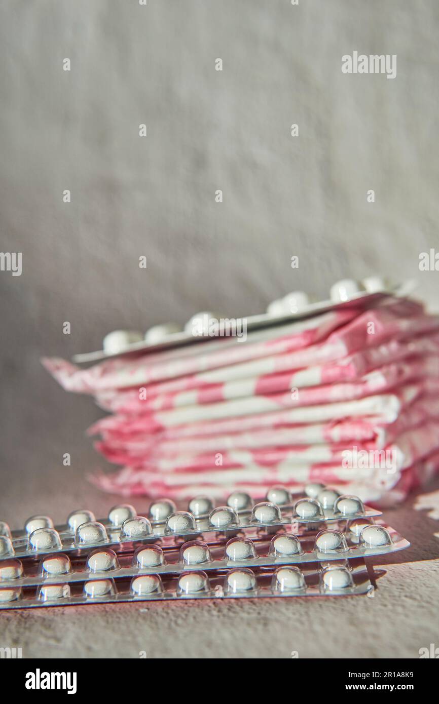 Contraceptive pills and period pads Stock Photo - Alamy