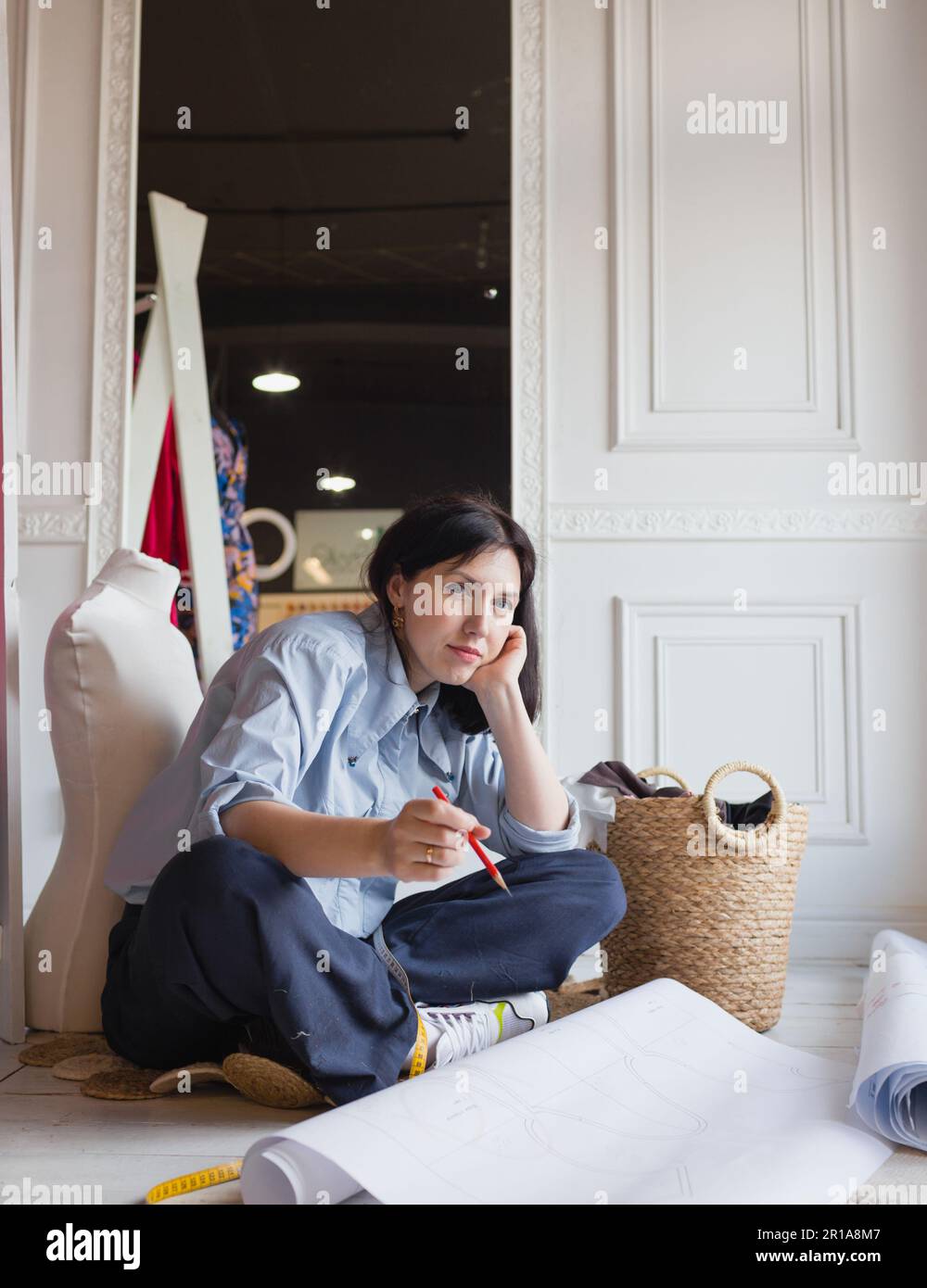 The designer-tailor makes measurements and a pattern for future clothes ...