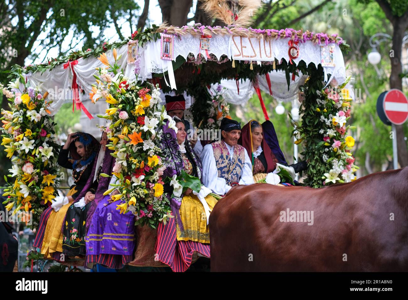 A traditional flower-covered, oxen-pulled chariot chart known as a ...