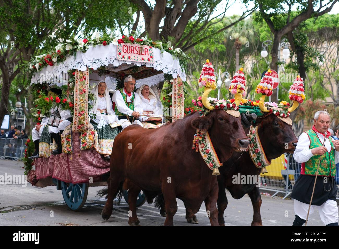 A traditional flower-covered, oxen-pulled chariot chart known as a ...