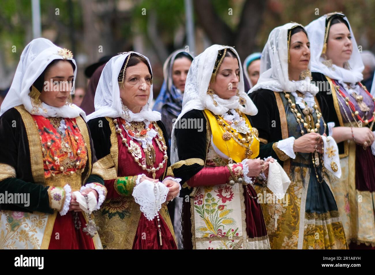 Sardinian women dressed in folk traditional costumes, with unique ...