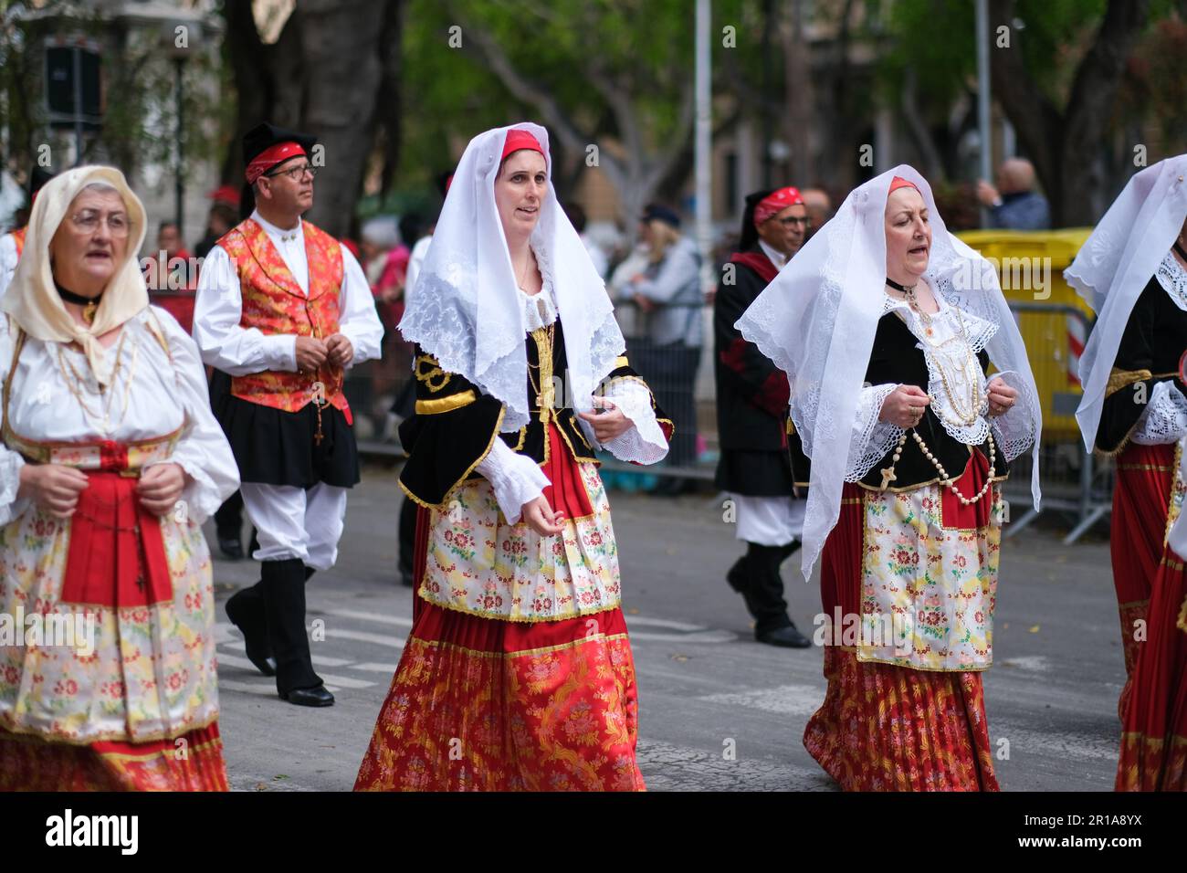 Sardinian women dressed in folk traditional costumes, with unique ...