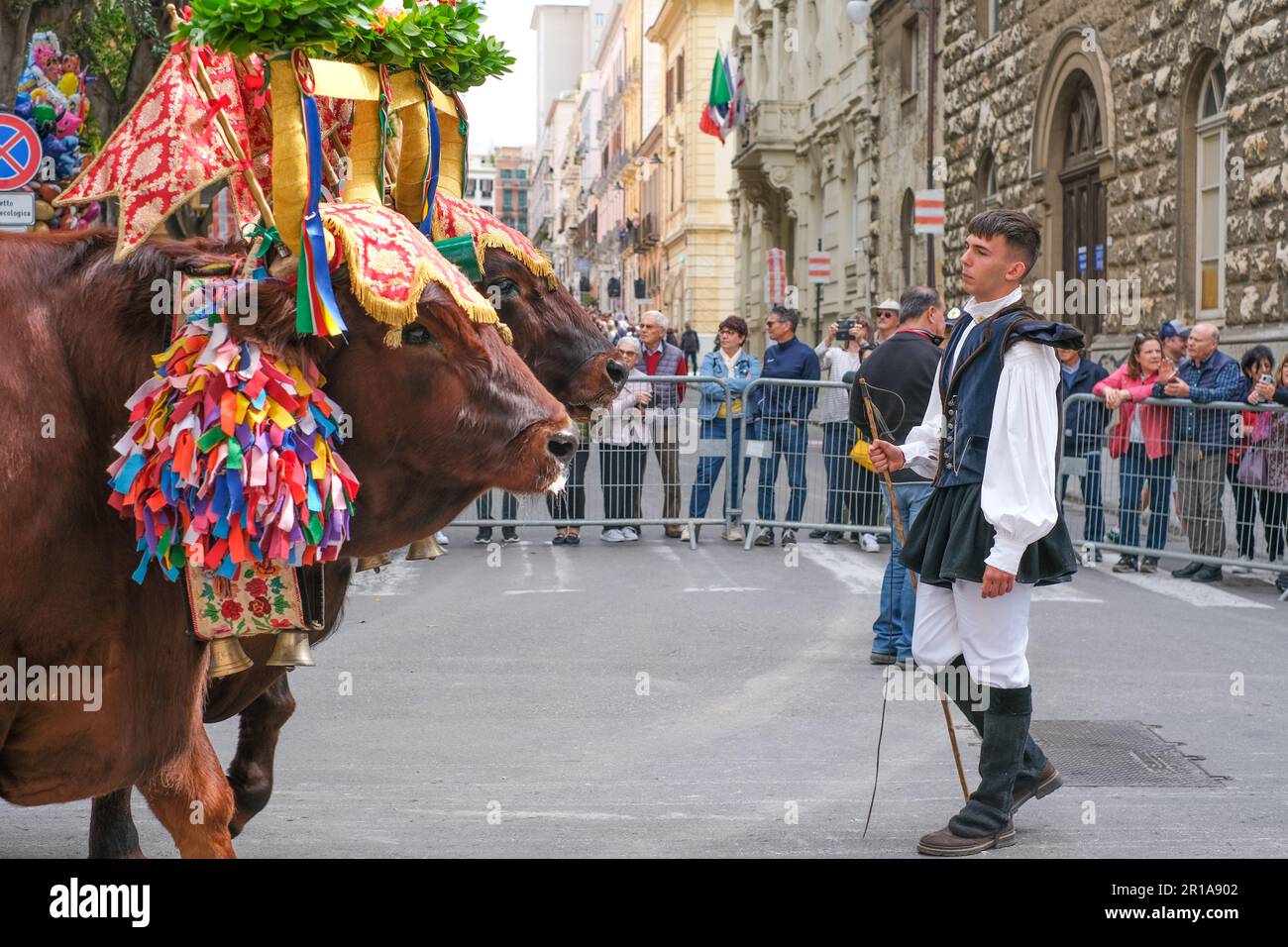 A traditional flower-covered, oxen-pulled chariot chart known as a ...