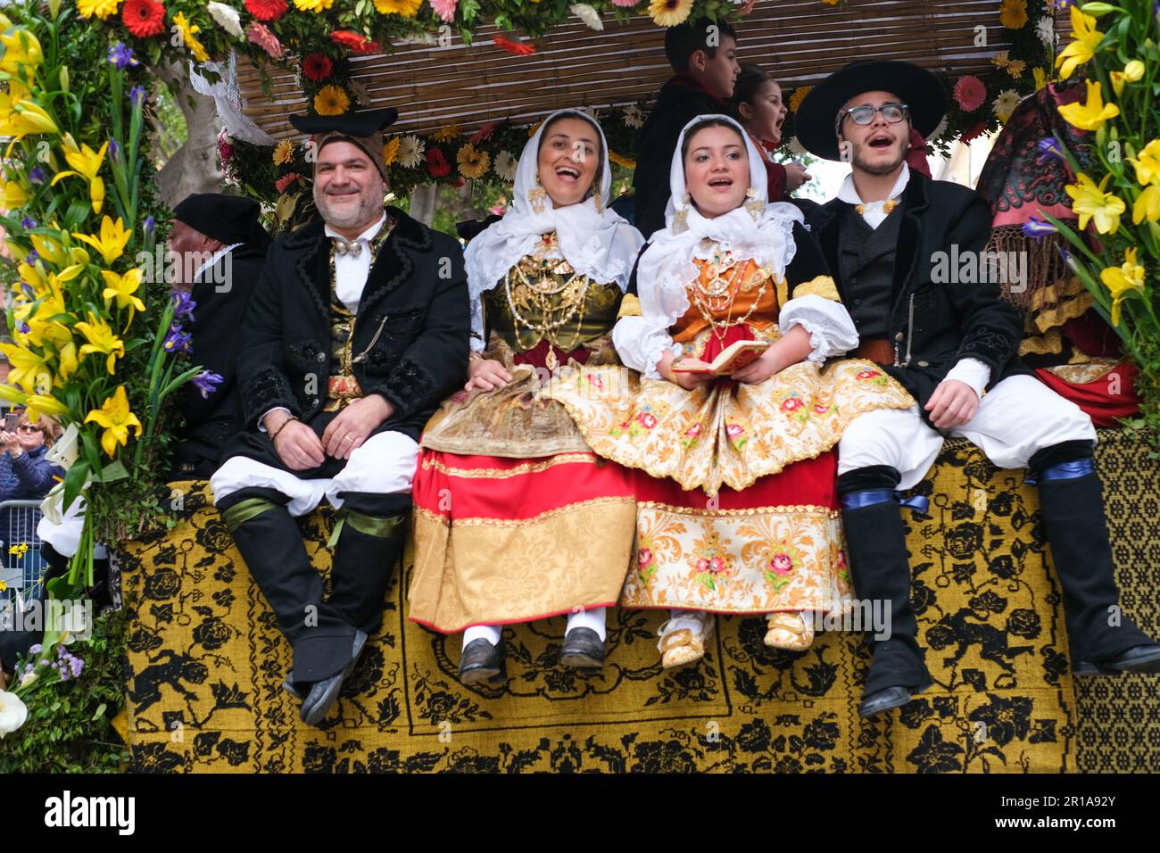 A traditional flower-covered, oxen-pulled chariot chart known as a ...