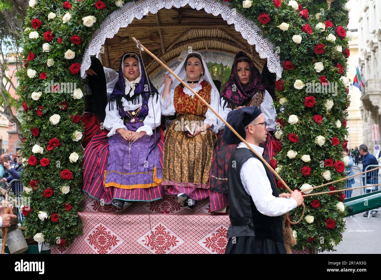 A traditional flower-covered, oxen-pulled chariot chart known as a ...