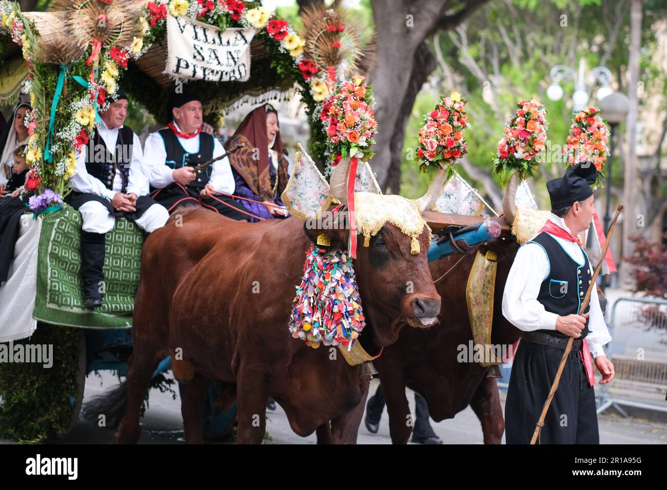 A traditional flower-covered, oxen-pulled chariot chart known as a ...