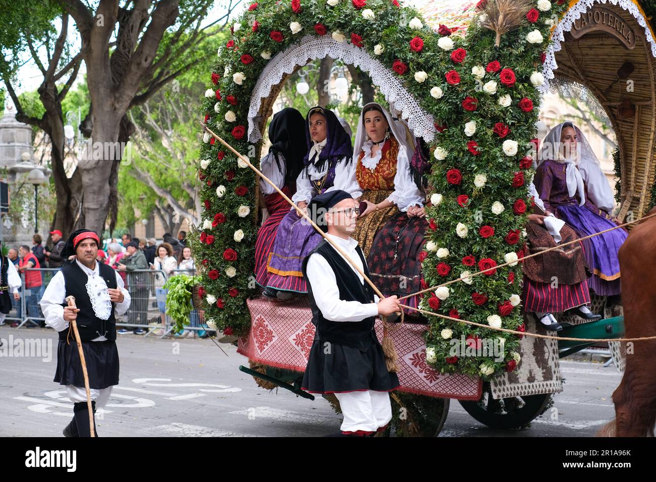 A traditional flower-covered, oxen-pulled chariot chart known as a ...