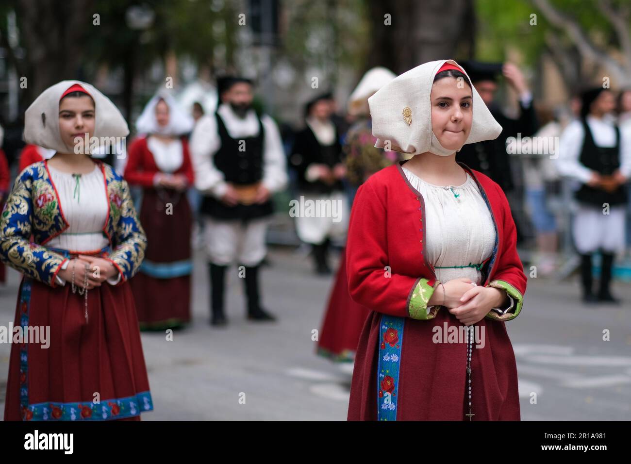 Sardinian women dressed in folk traditional costumes, with unique ...