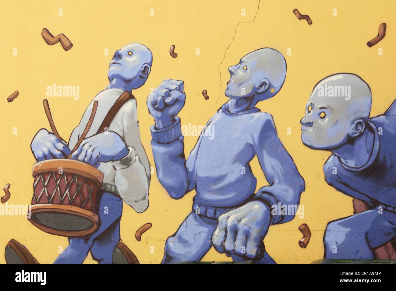 Street art graffiti of blue men playing musical instruments on a wall ...