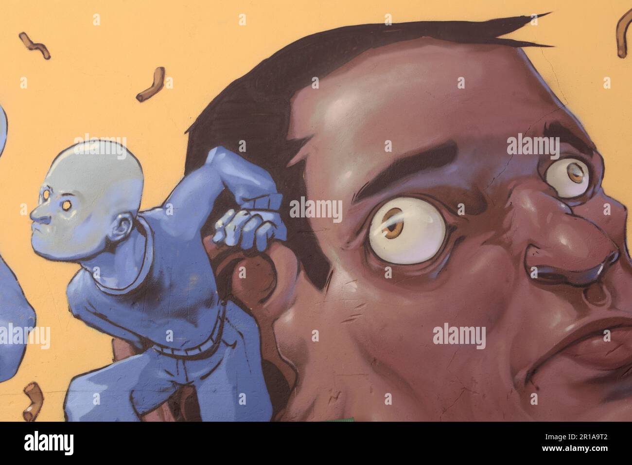 Street art graffiti of blue men playing musical instruments on a wall ...