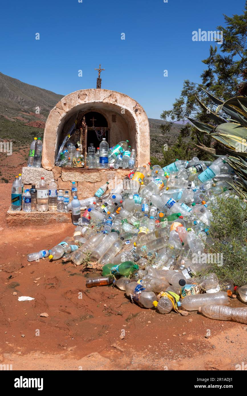 Sacrificial altar with bottles filled with water as an sacrificial ...