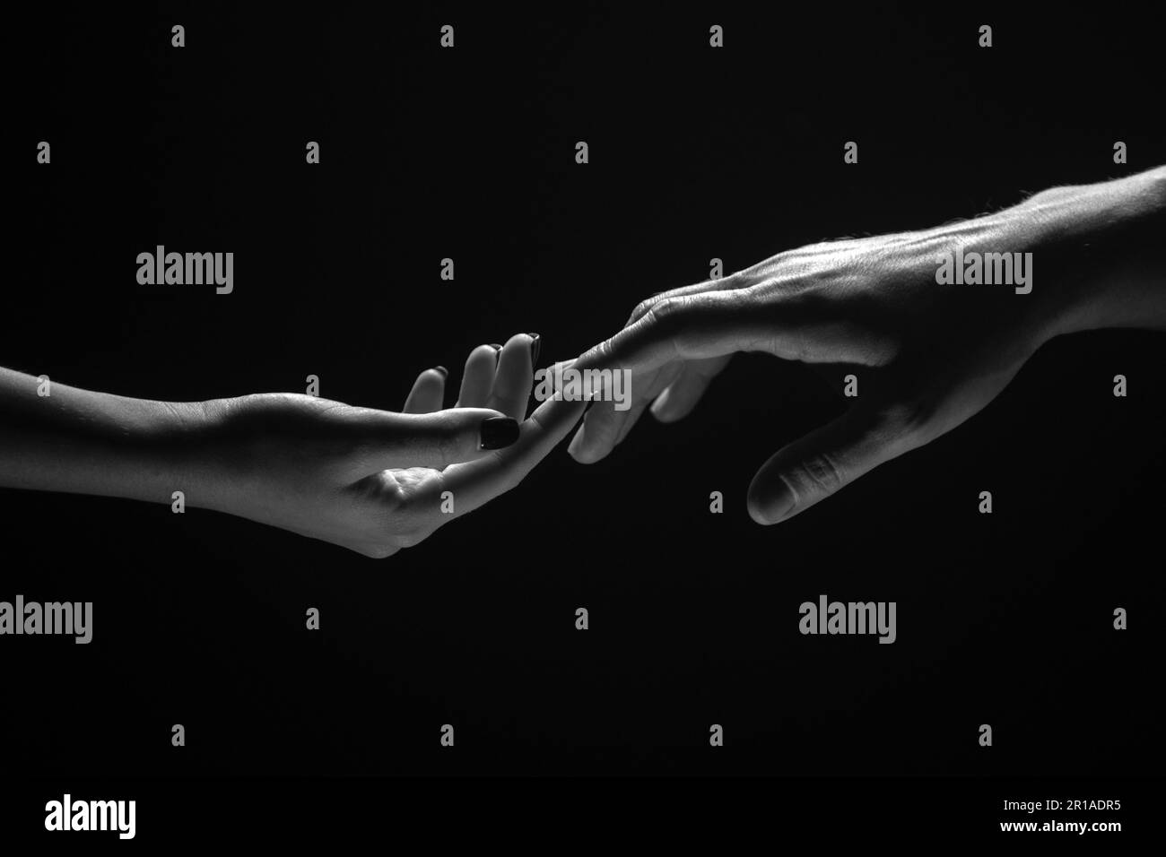 Romantic touch with fingers, love. Two hands stretch each other, black ...