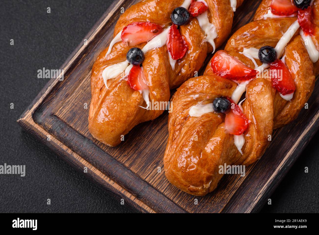 Delicious fresh crispy pastry in the form of a pigtail with ...