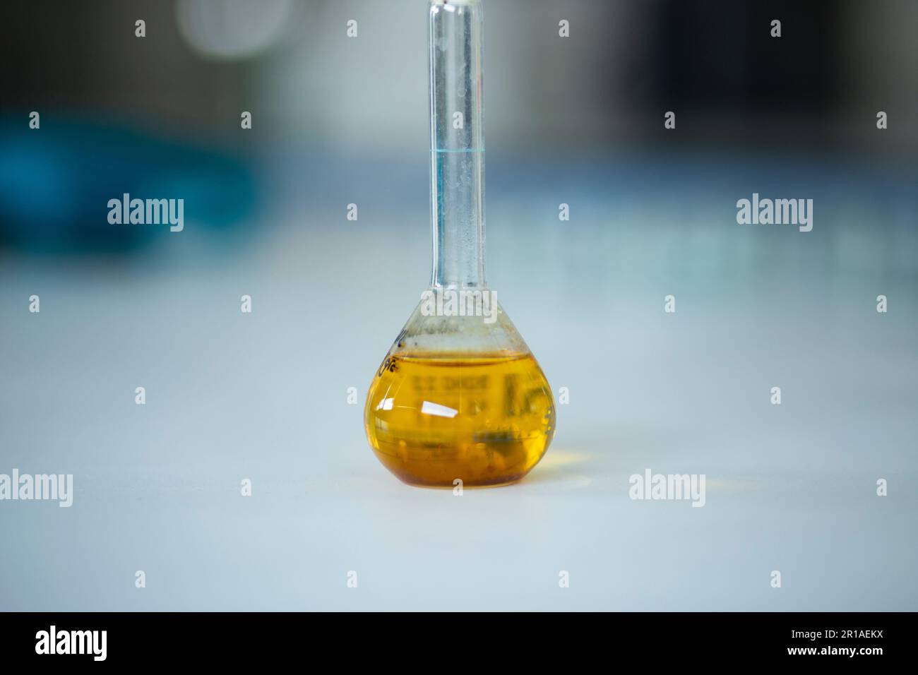 A laboratory test tube filled with a clear yellow liquid Stock Photo ...