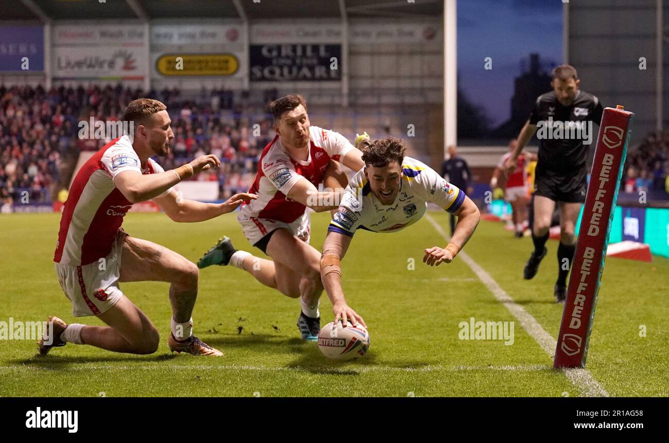 Warrington Wolves' Matty Ashton dives in to score his sides third try ...