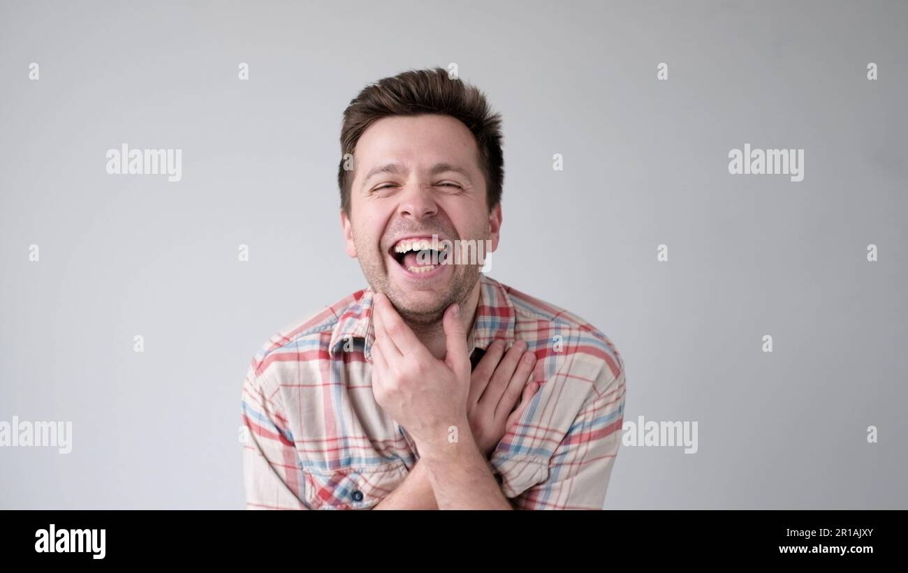 European funny young man is laughing loudly. Positive emotion Stock ...