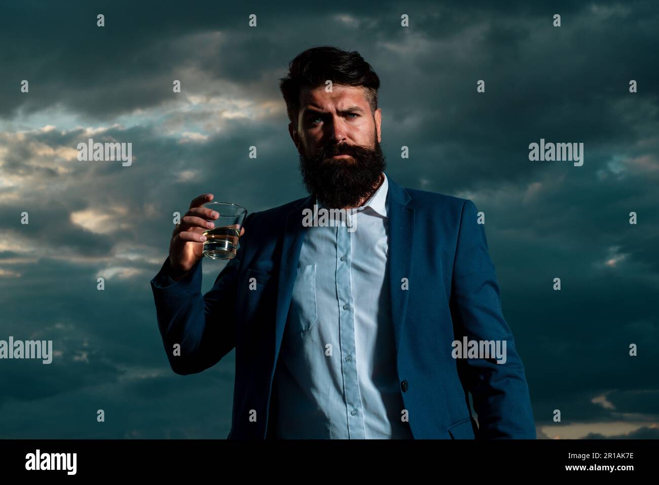 Luxury life, rich man drink expensive beverage. Brandy scotch or whisky ...