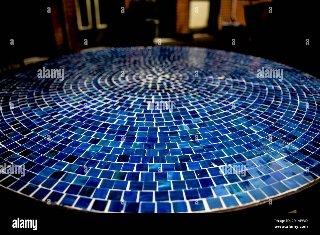 blue mosaic round table in outdoor urban area Stock Photo - Alamy