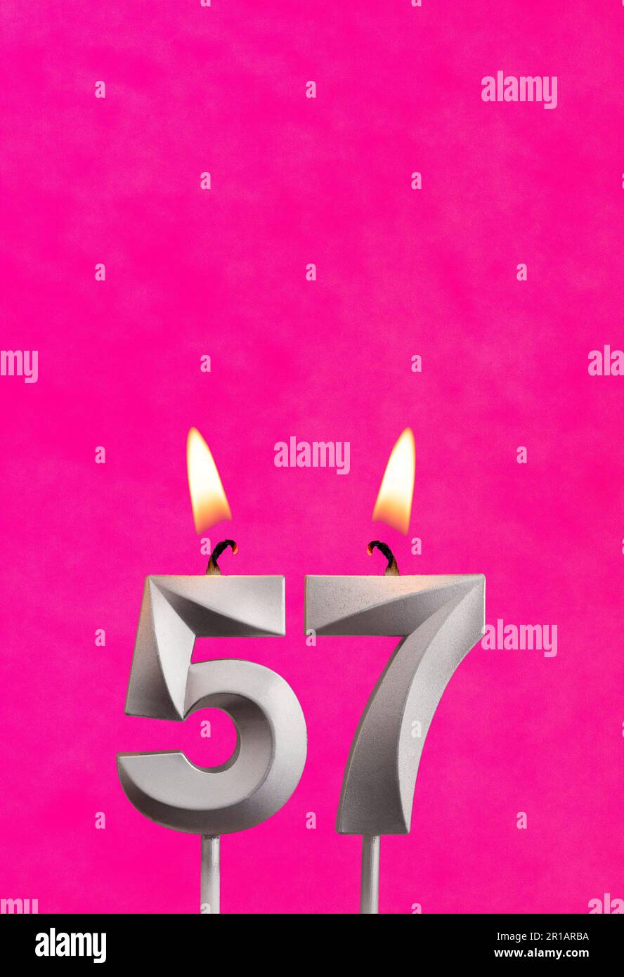 Number 57 candle - Birthday celebration on fuchsia background Stock ...