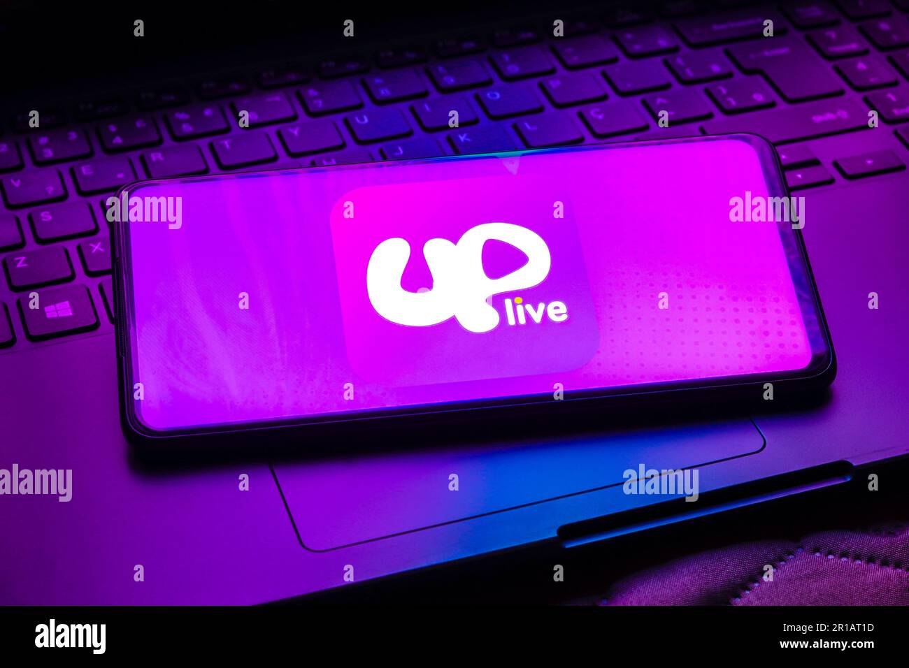 In this photo illustration, the Uplive logo is displayed on a ...