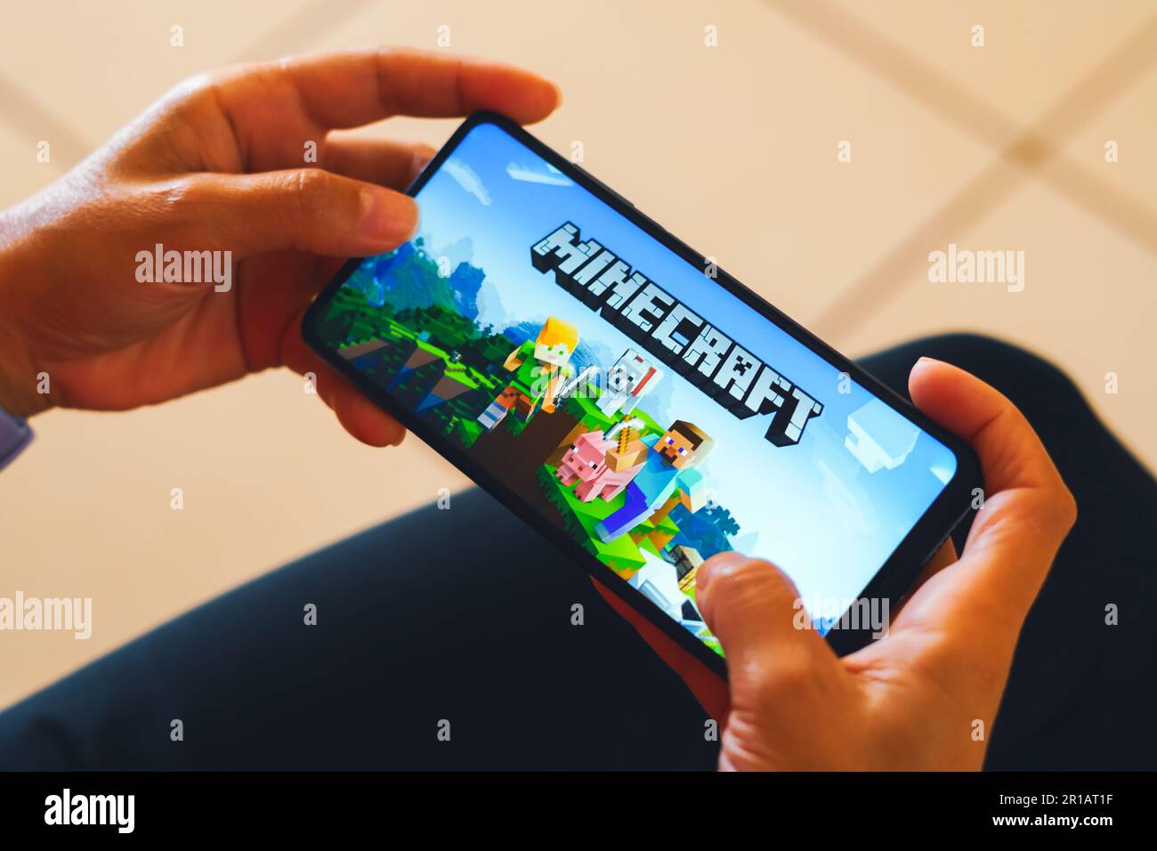 In this photo illustration, the Minecraft logo is displayed on a ...