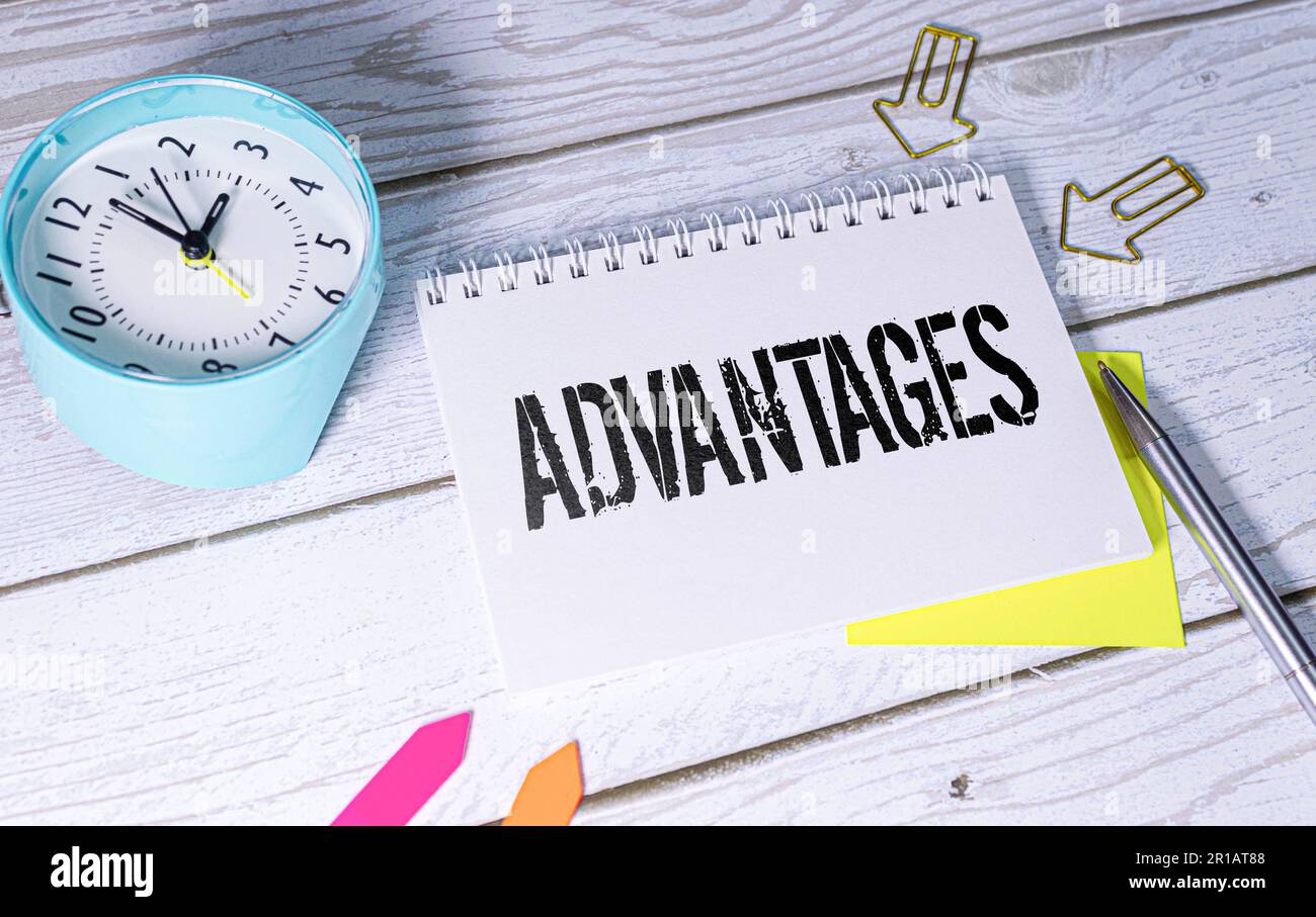 Hand writing 'advantages', isolated on beautiful white background ...