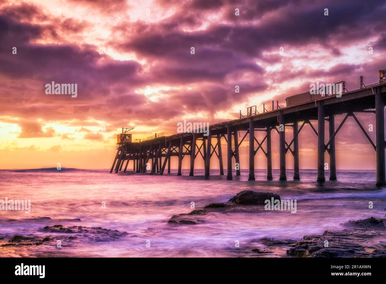 Long timber historic jetty off Catherine Hill bay Middle camp beach at ...