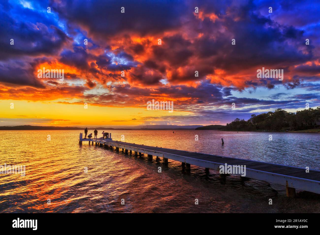 Long timber jetty off Cams wharf Murrays beach lakeshore town on Lake ...