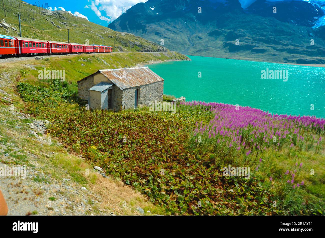 Sankt Moritz Switzerland May 13 2023: Little red train traveling in the ...