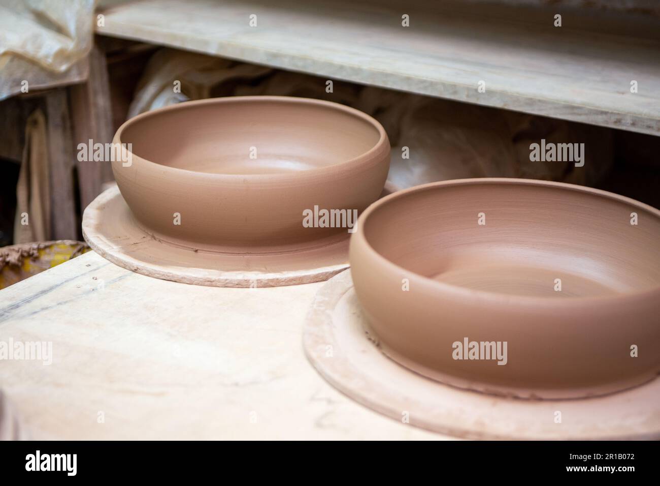 Unfinished Ceramic Bowls drying to be decorated Stock Photo - Alamy