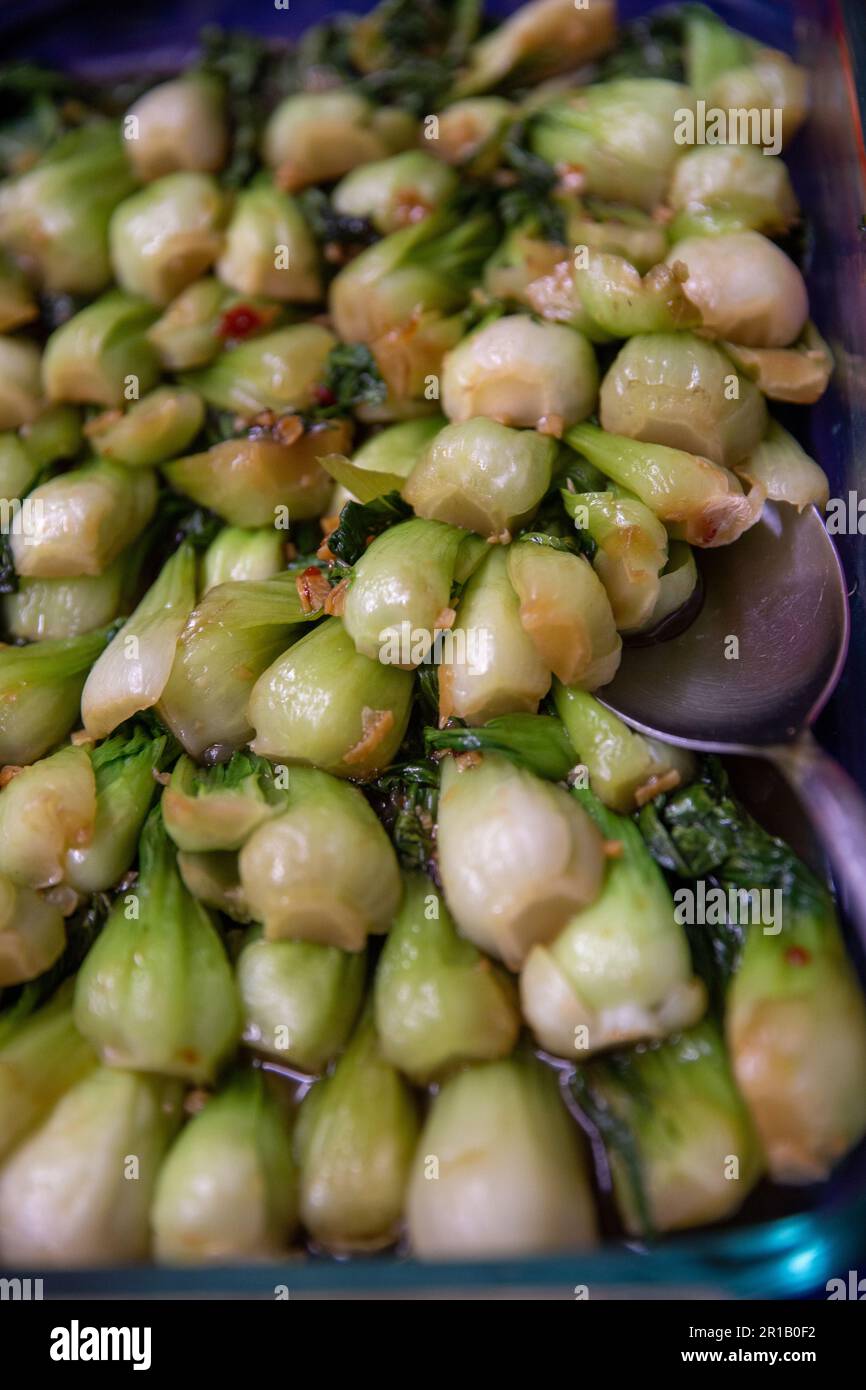Baby Bok Coy with a spoon to serve Stock Photo - Alamy