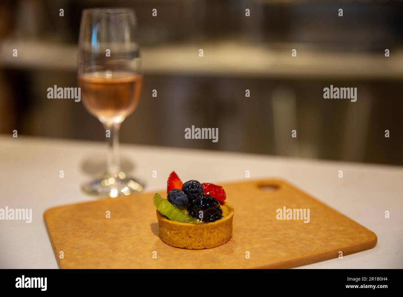 Wine with a tarlet with fruit Stock Photo - Alamy
