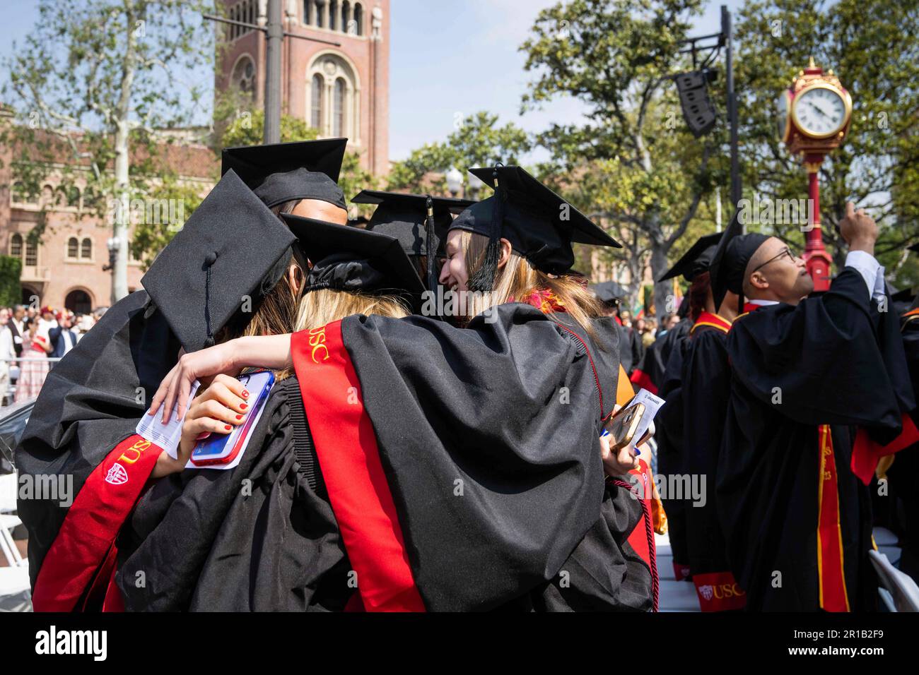 Graduates embrace during Southern California's 140th commencement ...