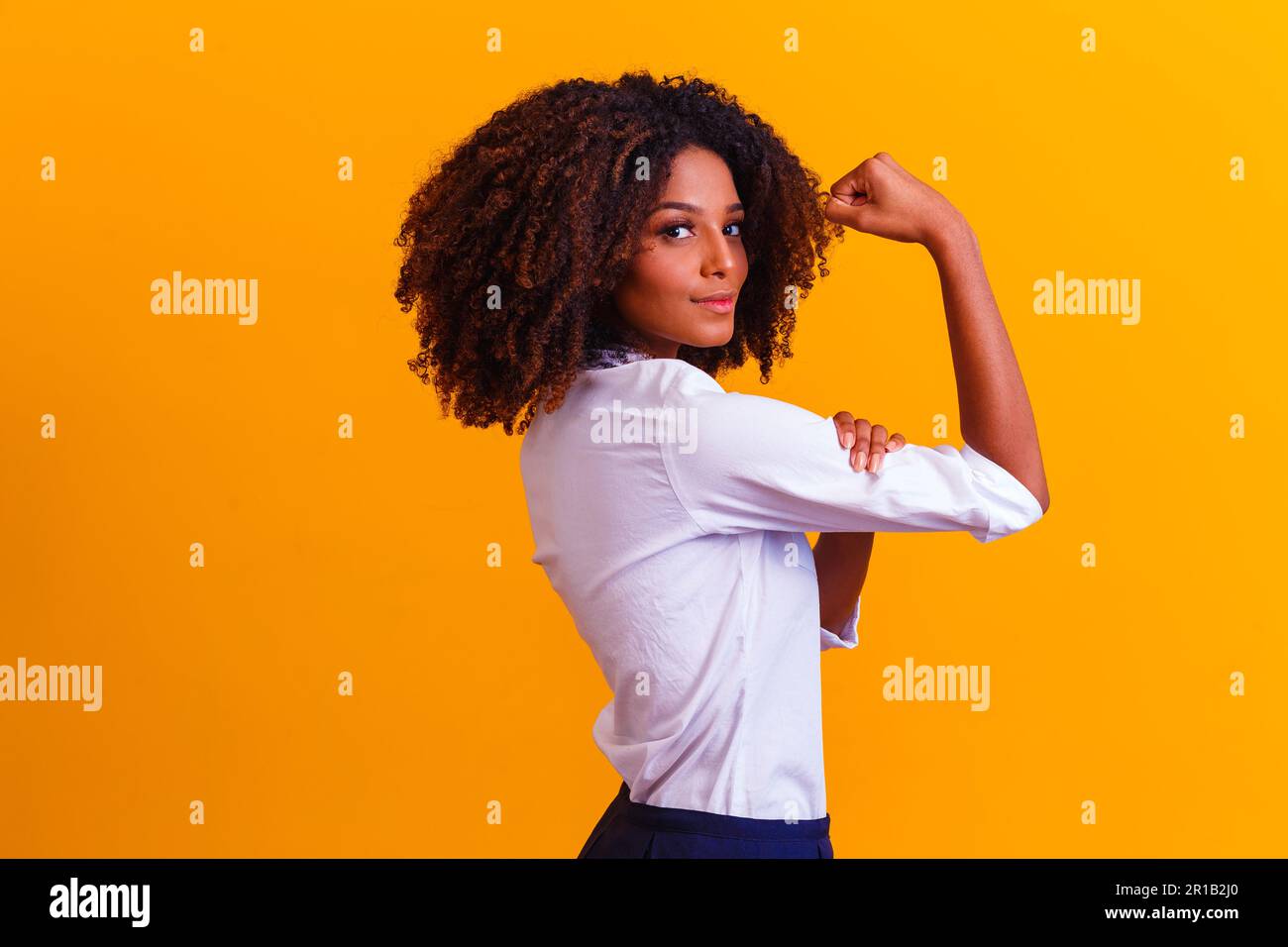 We can do it. Woman's fist of female power. Woman victim of racism ...