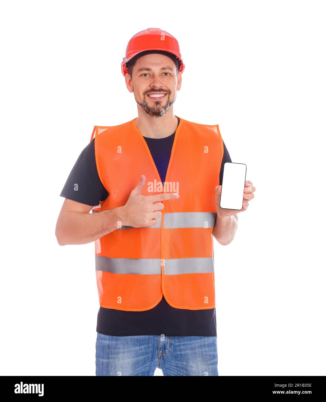 Male industrial engineer in uniform with phone on white background ...