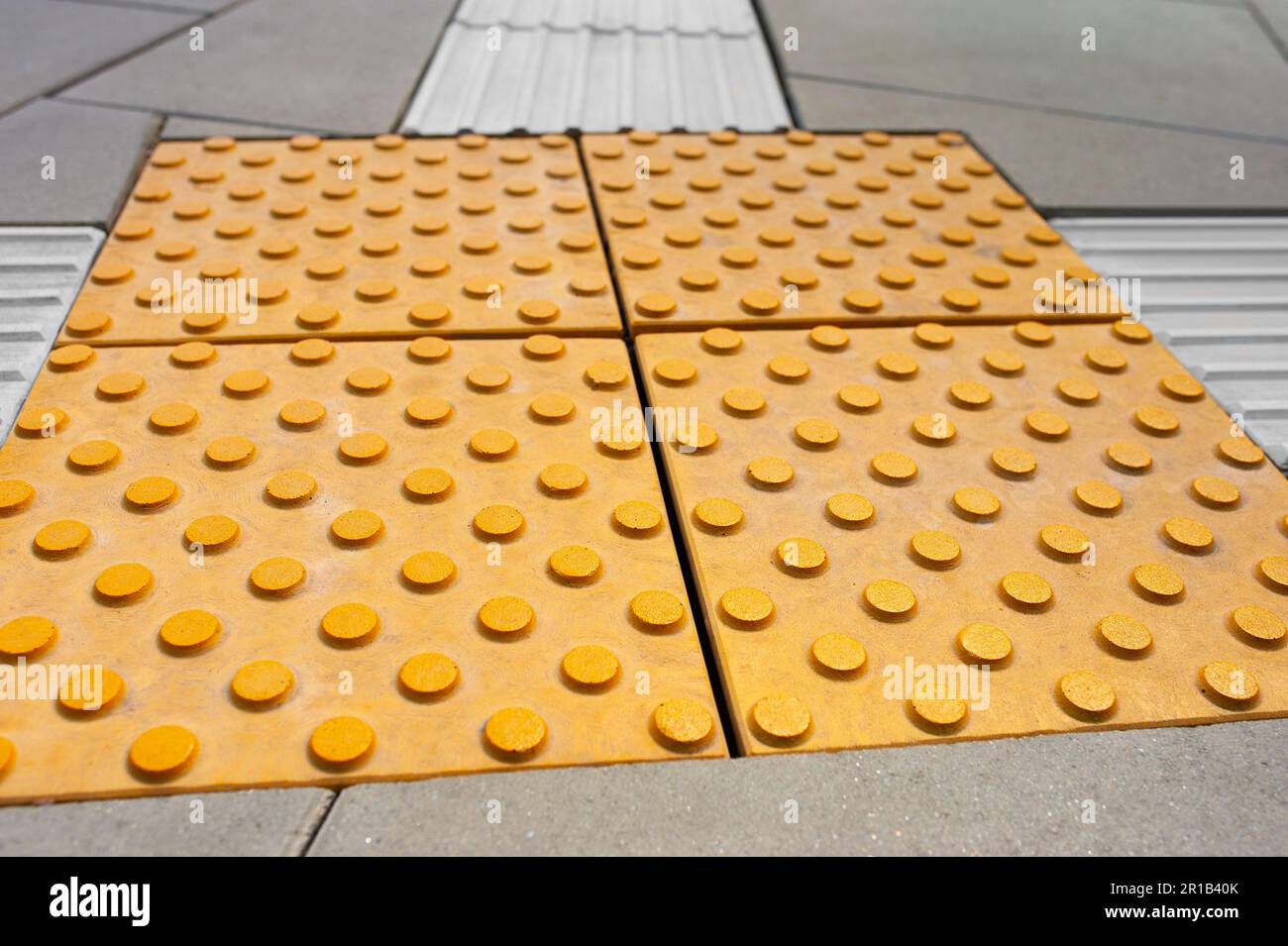Tiles with tactile ground surface indicators, closeup view Stock Photo ...