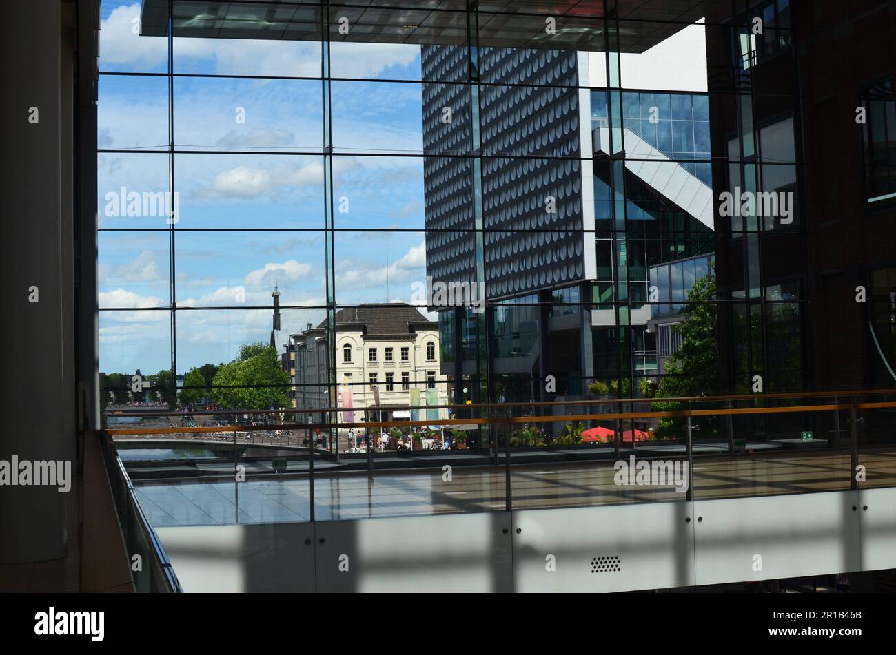 Beautiful city street with buildings, view through big glass windows ...