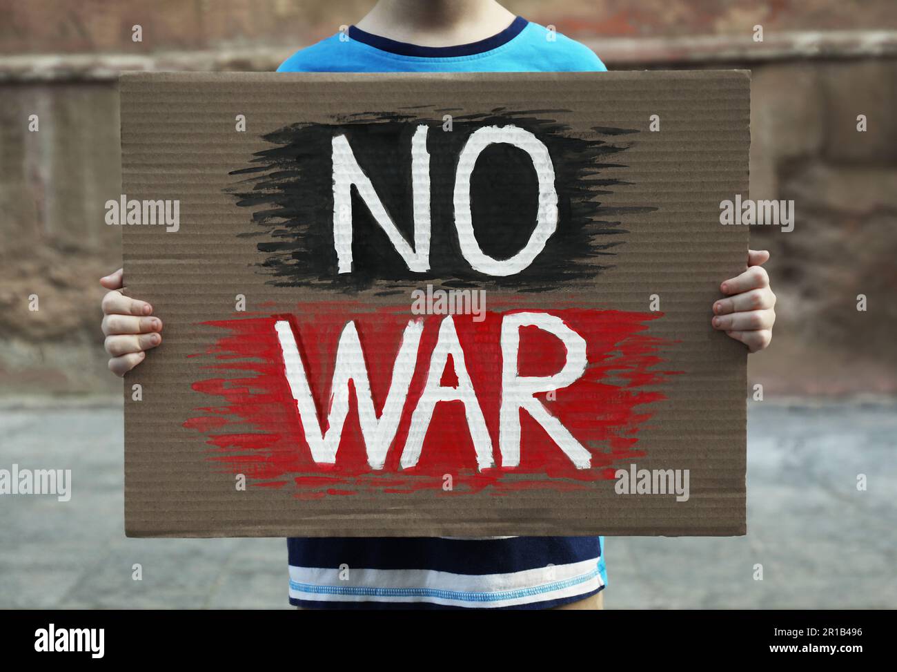 Boy holding poster with words No War outdoors, closeup Stock Photo - Alamy