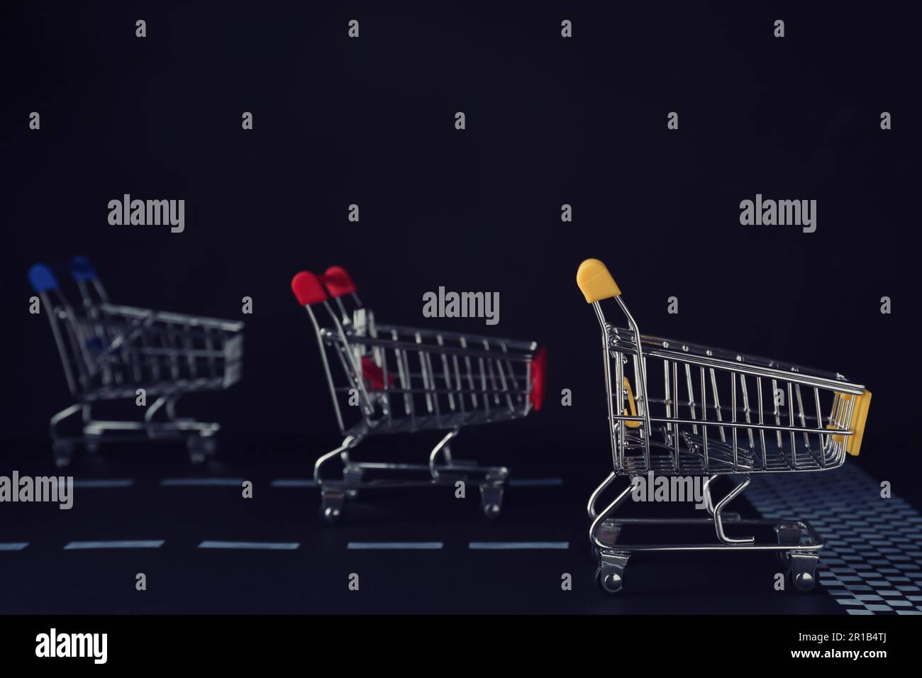 Competition concept. Shopping carts racing towards finish line Stock ...