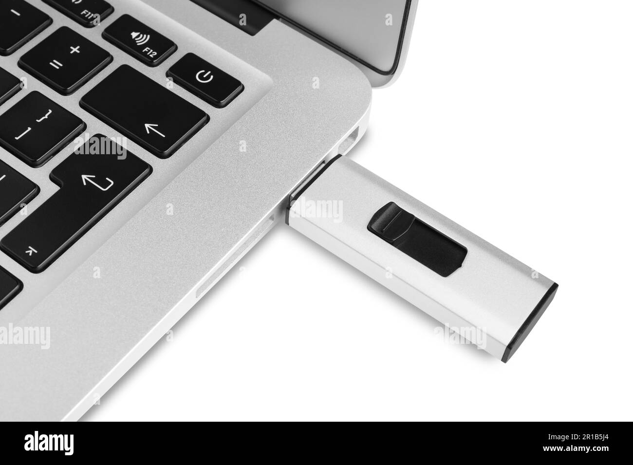 Modern usb flash drive attached into laptop on white background ...