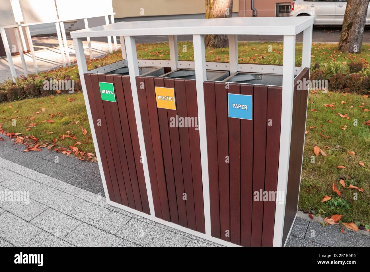 Different sorting bins for waste recycling on city street outdoors ...