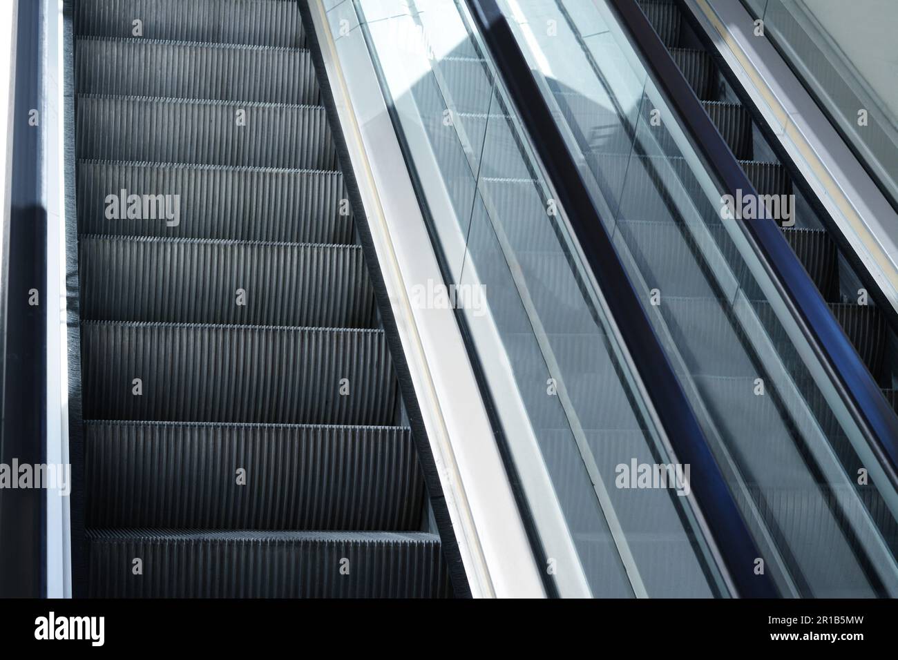 Modern escalators with handrails in shopping mall, closeup Stock Photo ...