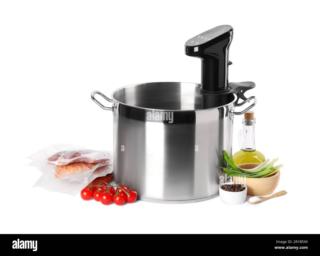 Thermal immersion circulator in pot and ingredients on white background ...