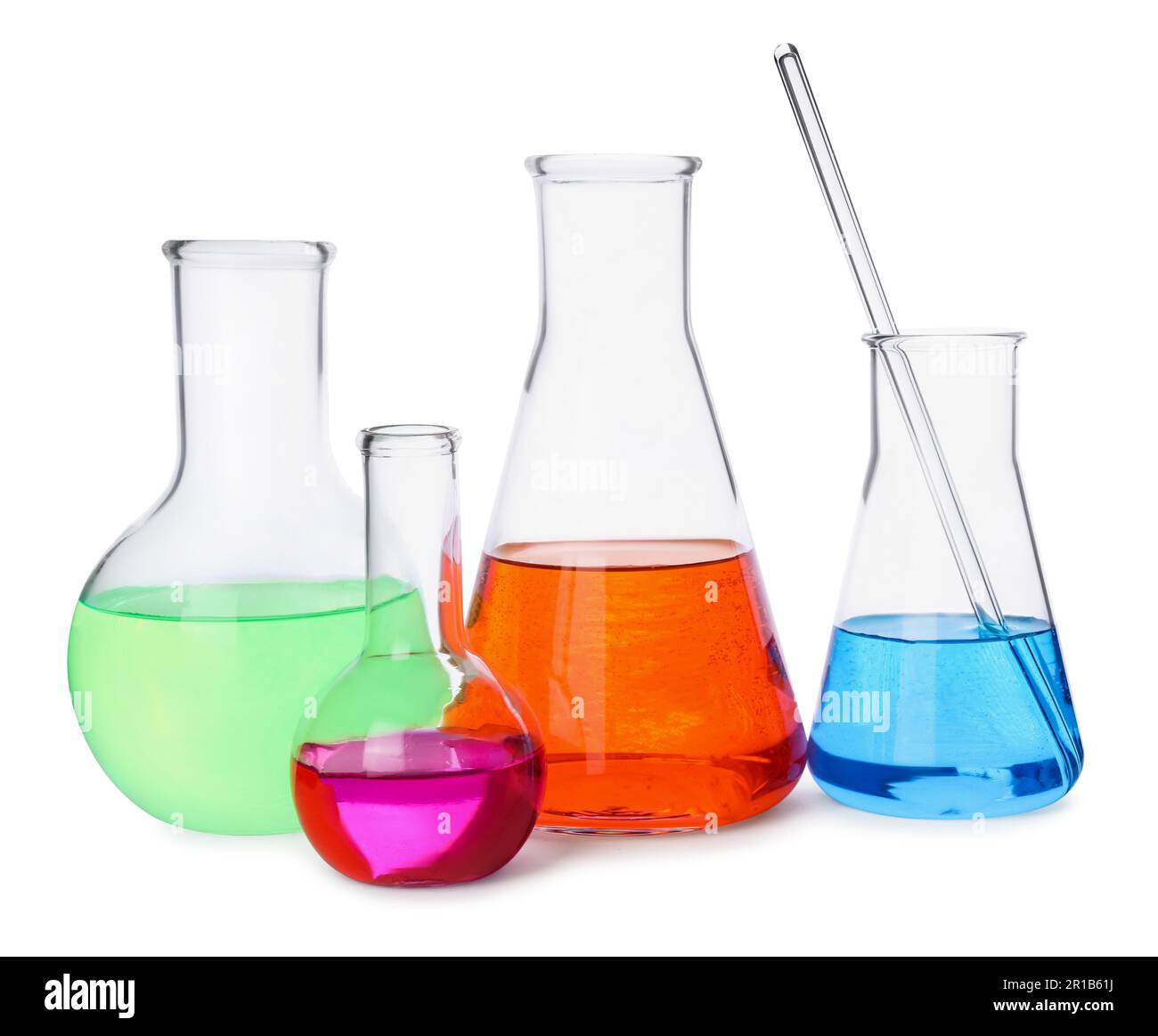 Different laboratory glassware with colorful liquids on white ...