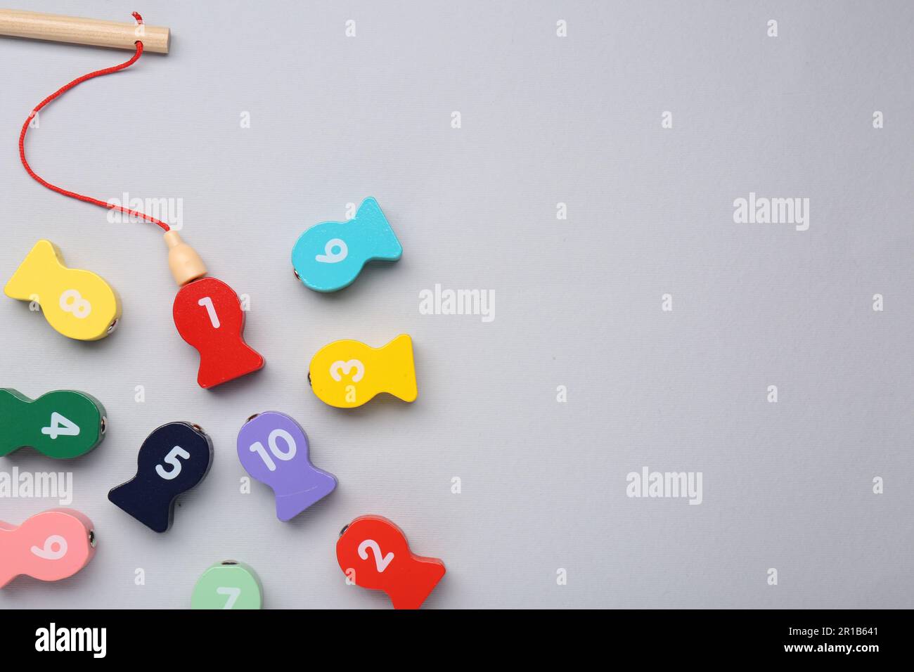 Educational game Fishing for Numbers on light grey background, flat lay ...