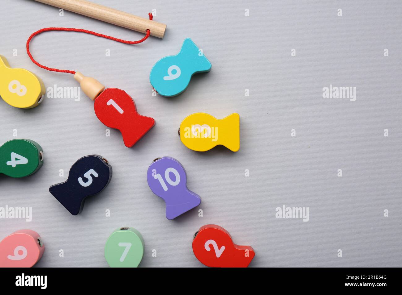 Educational game Fishing for Numbers on light grey background, flat lay ...