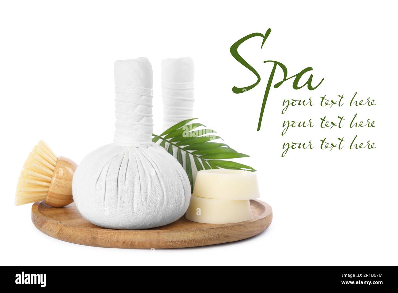 Wooden tray with herbal massage bags and different spa products on ...