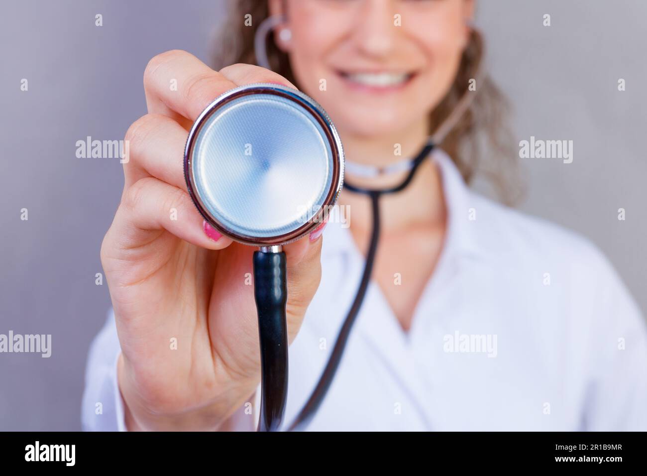 Close-up of female doctor using stethoscope , focus on stethoscope ...
