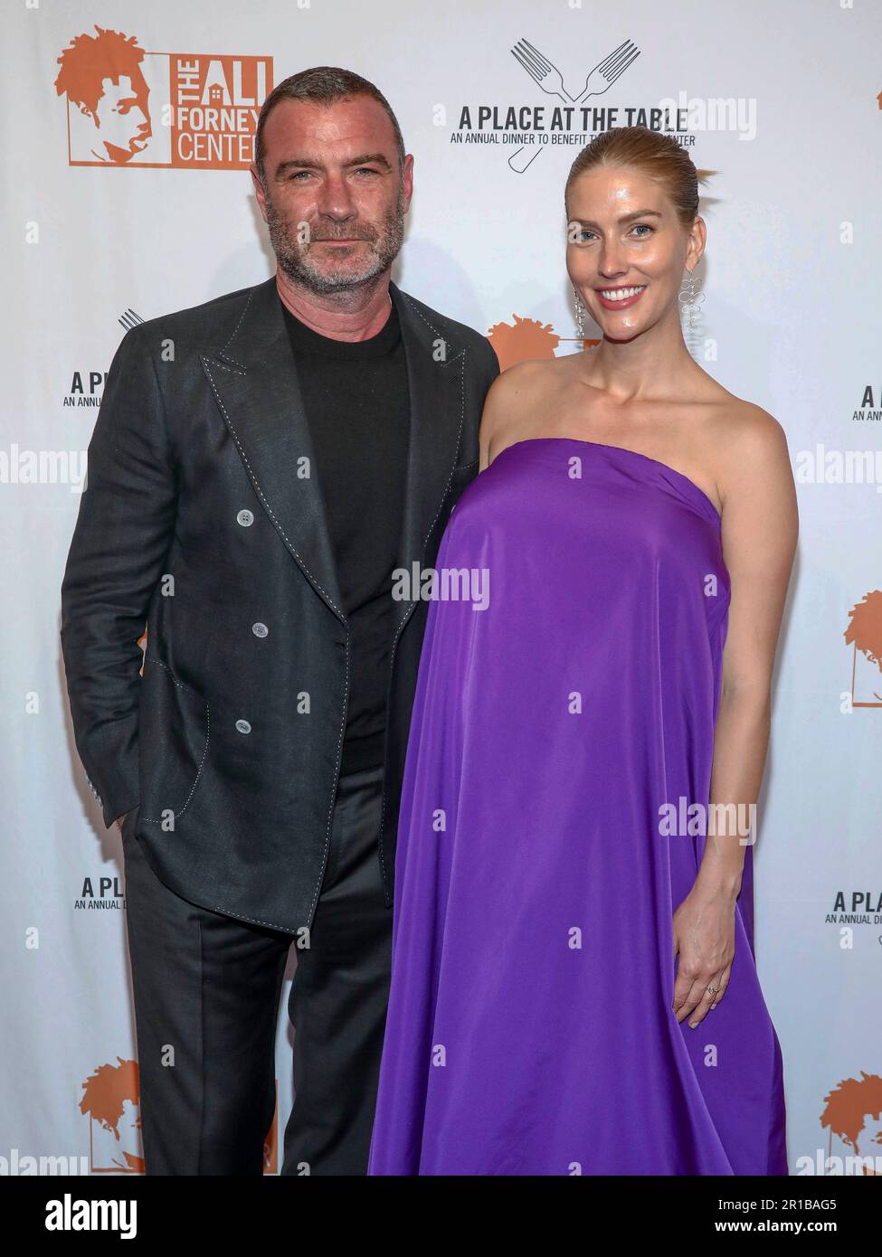 Actor Liev Schreiber, left, and fashion model Taylor Neisen attend the ...